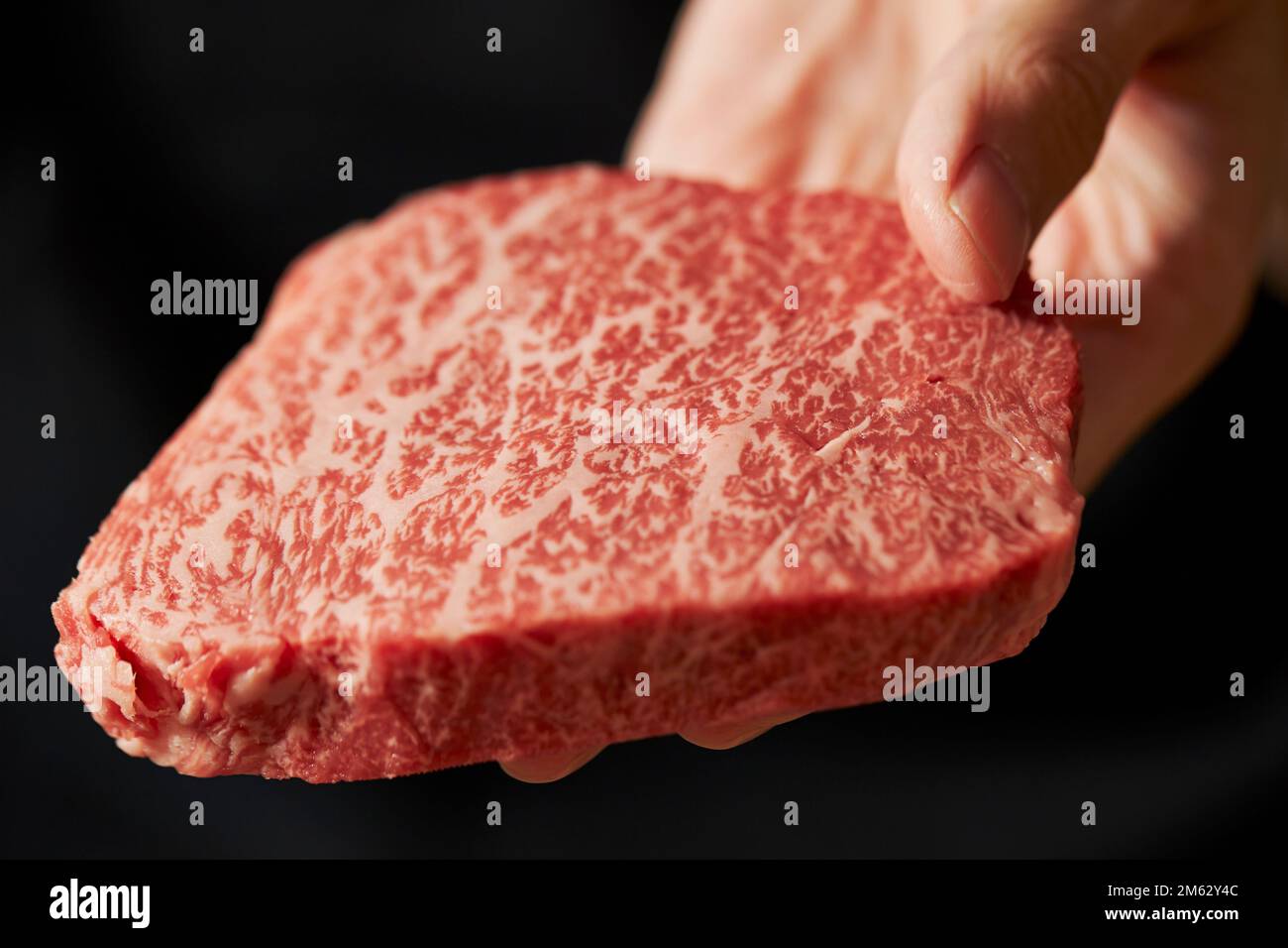 raw meat in the hands of the chef Stock Photo - Alamy