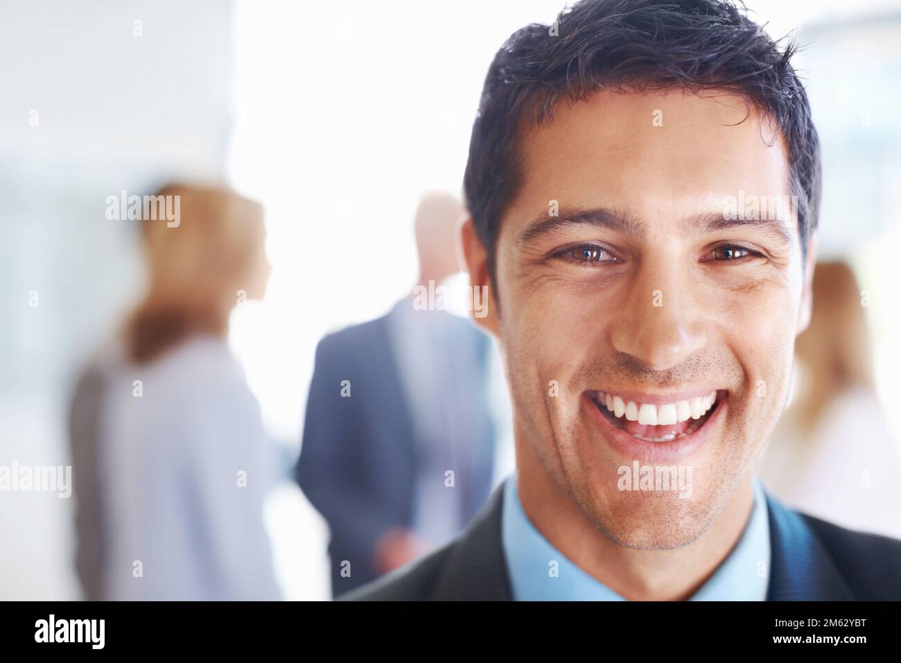 Smiling business man with executives conversing. Closeup of cheerful ...