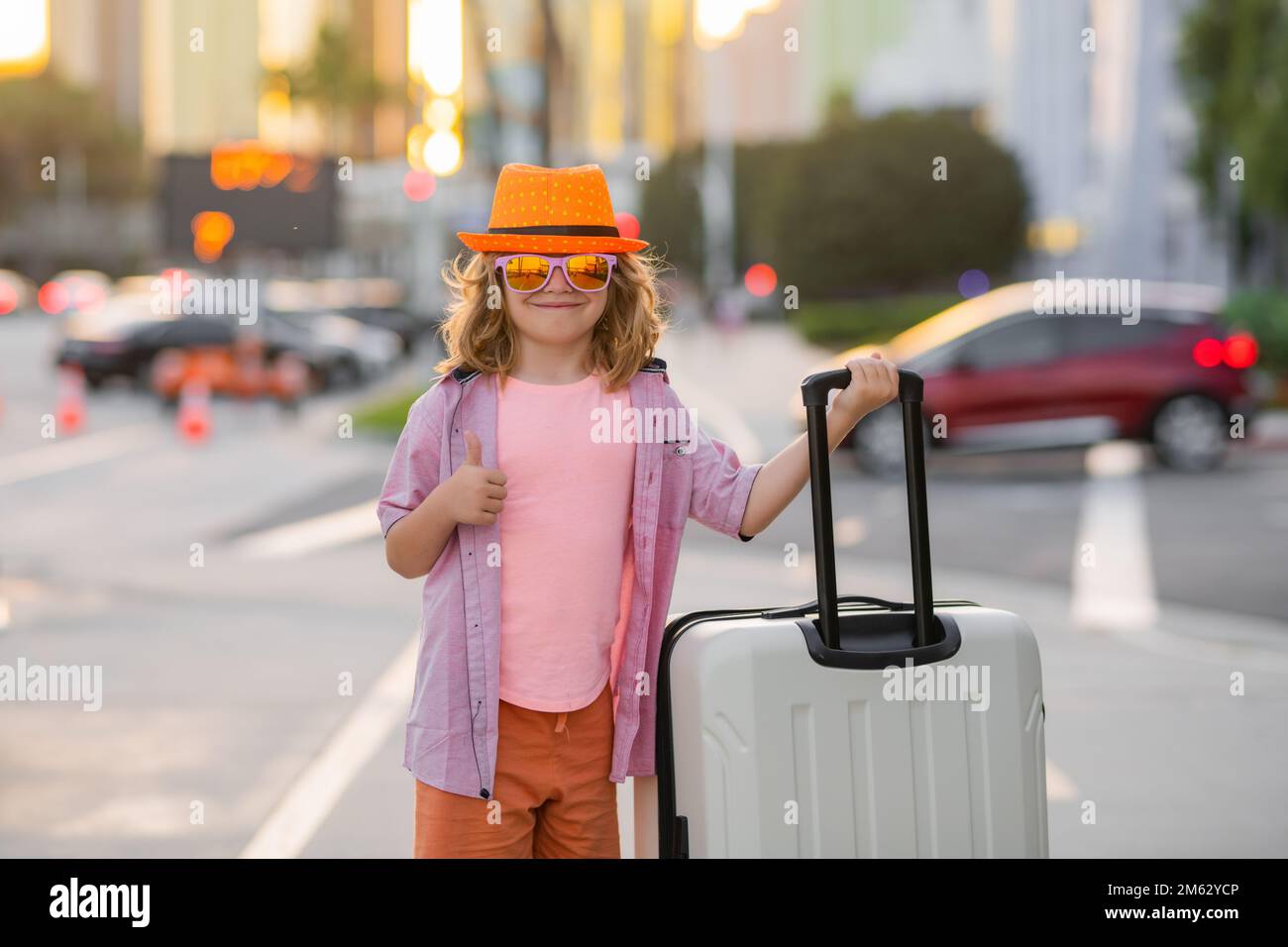 Kid with travel bag ready to travelling on his vacation. Travel concept ...