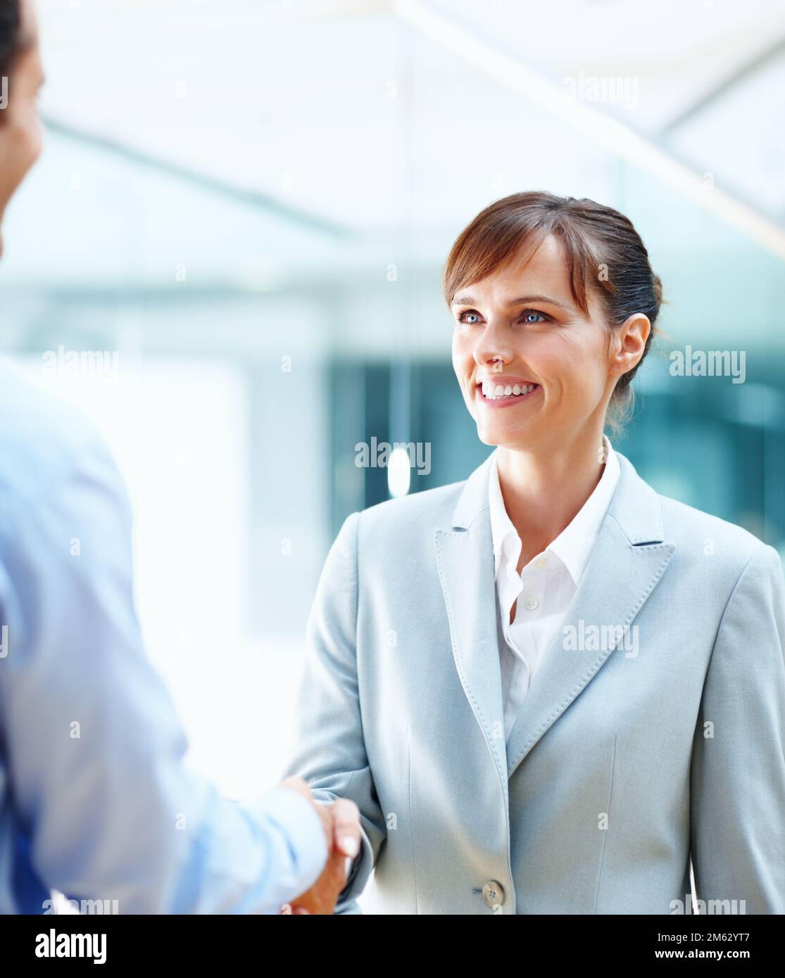 Youve got yourself a deal. two people shaking hands in a corporate ...