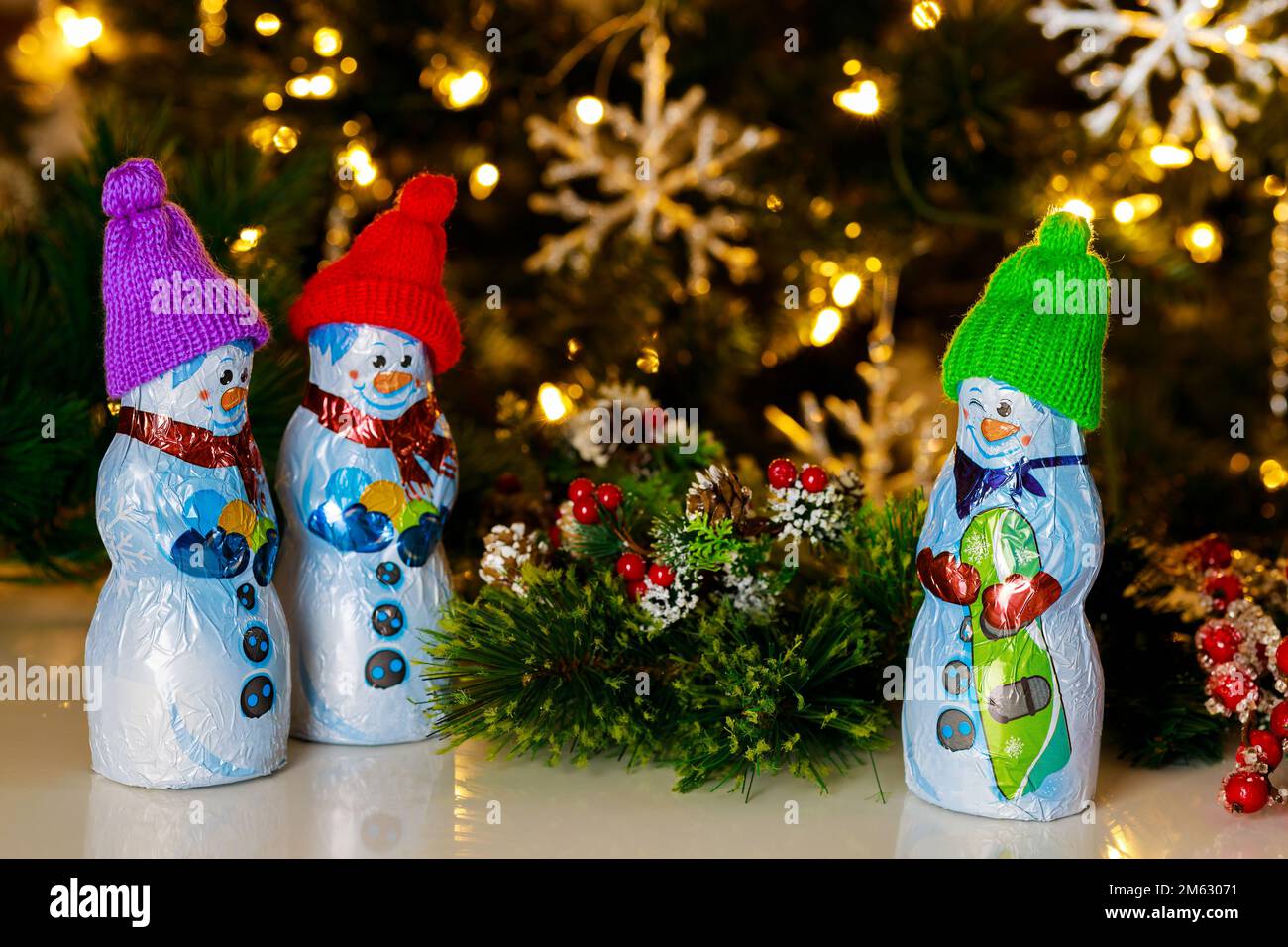 Chocolate snowman wrapped in Christmas wrapper Stock Photo - Alamy
