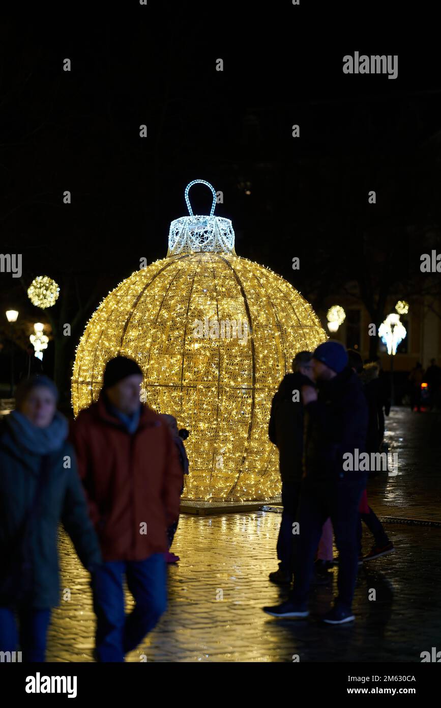 Christmas decoration with visitors on the cathedral square in Magdeburg ...