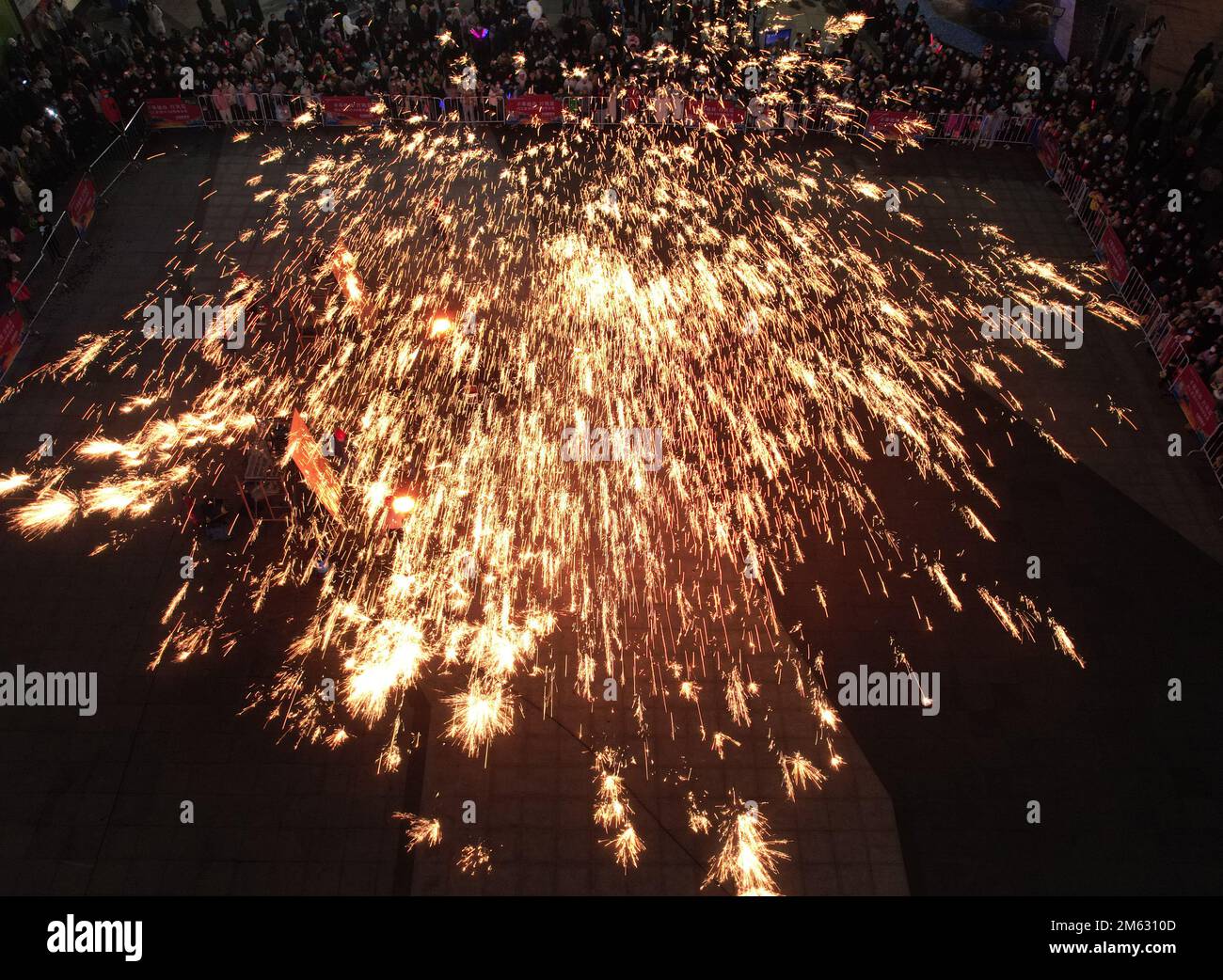 Aerial photo shows people watching the "Iron Flower" performance of an ...