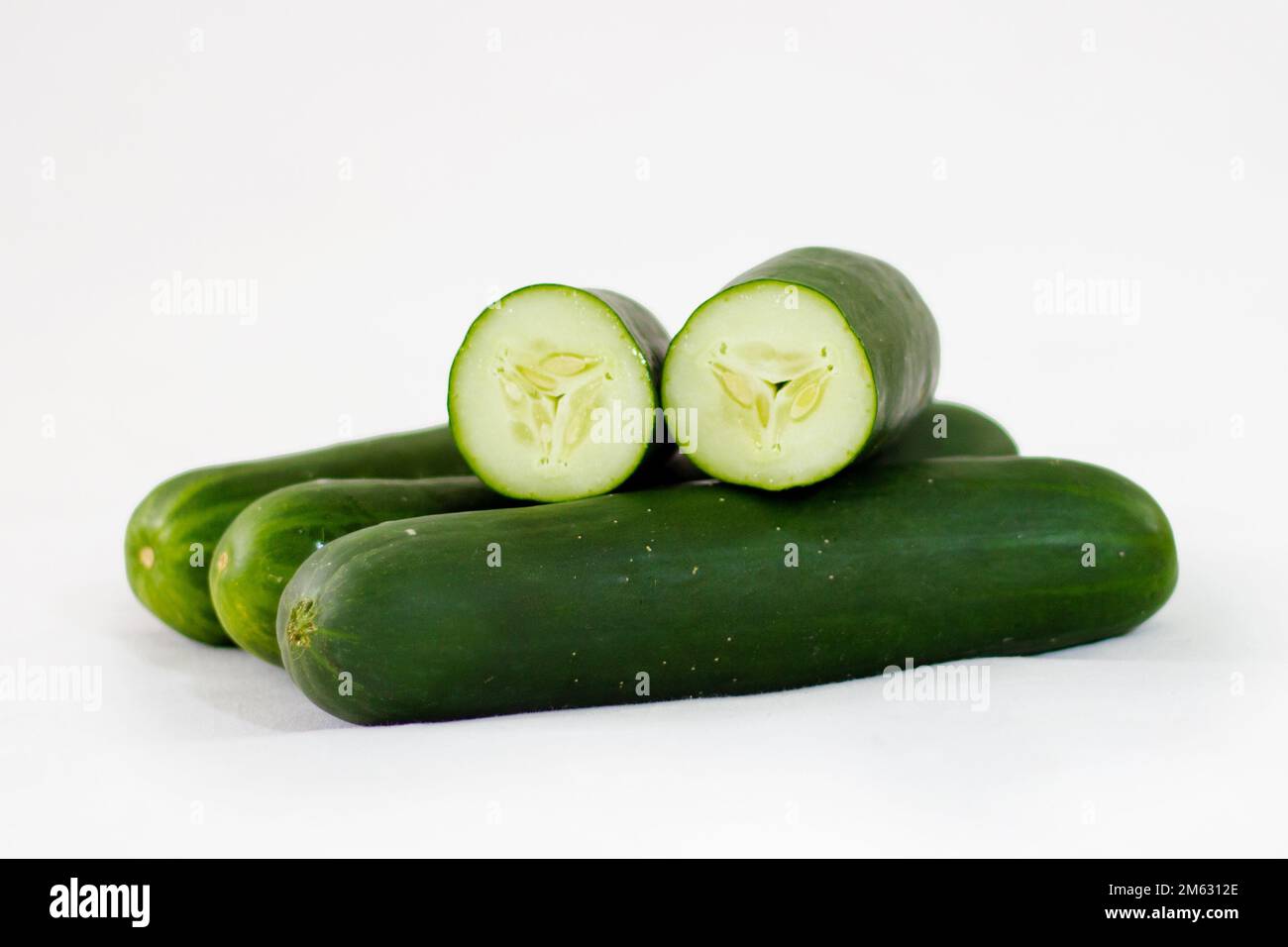 group of cucumbers on white background Stock Photo - Alamy
