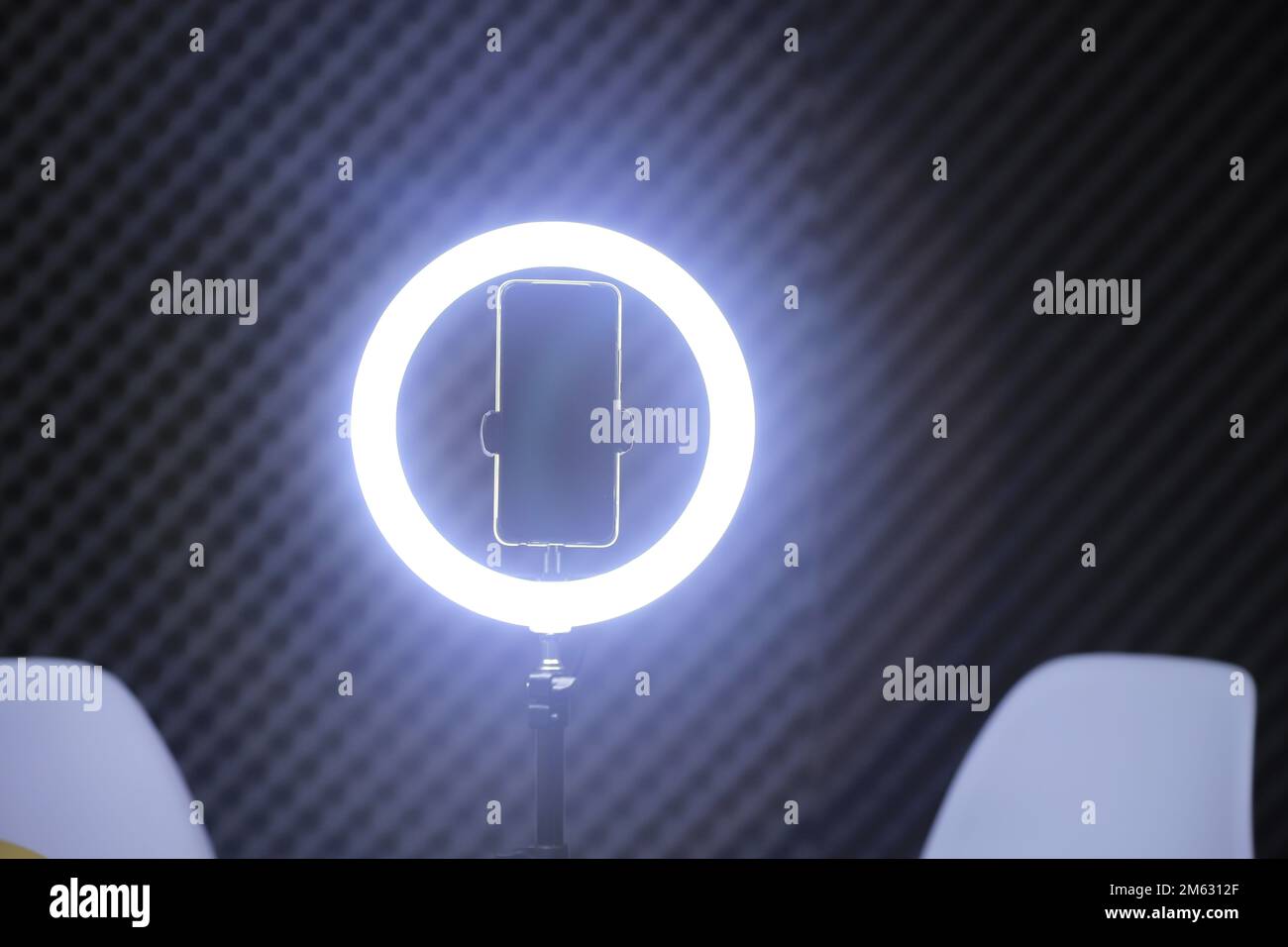 ring light with smarthphone and two white chairs Stock Photo - Alamy