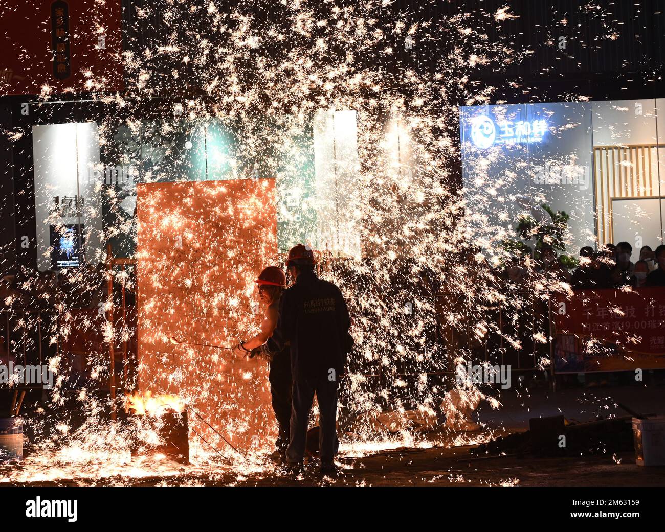 Aerial photo shows people watching the "Iron Flower" performance of an ...