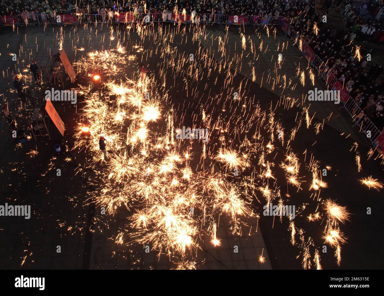 Aerial photo shows people watching the "Iron Flower" performance of an ...