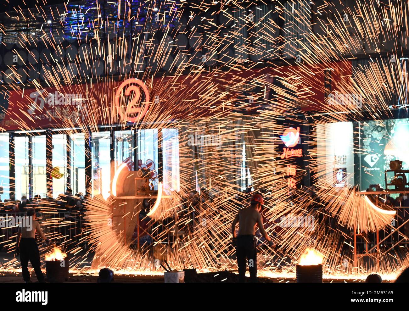 Aerial photo shows people watching the "Iron Flower" performance of an ...