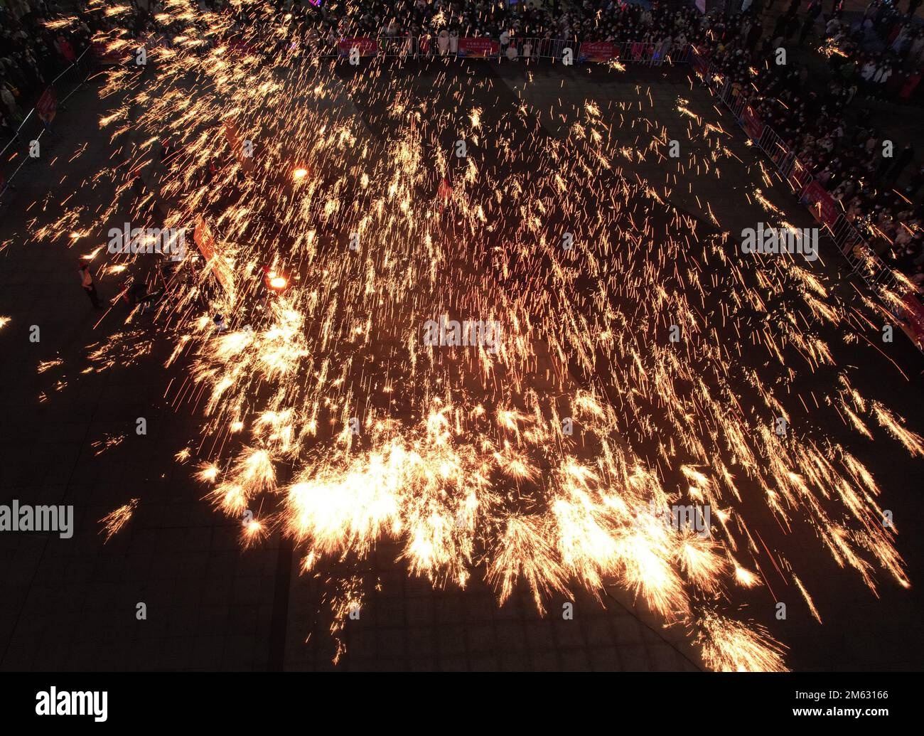 Aerial photo shows people watching the "Iron Flower" performance of an ...