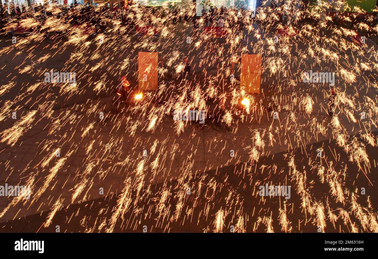 Aerial photo shows people watching the "Iron Flower" performance of an ...