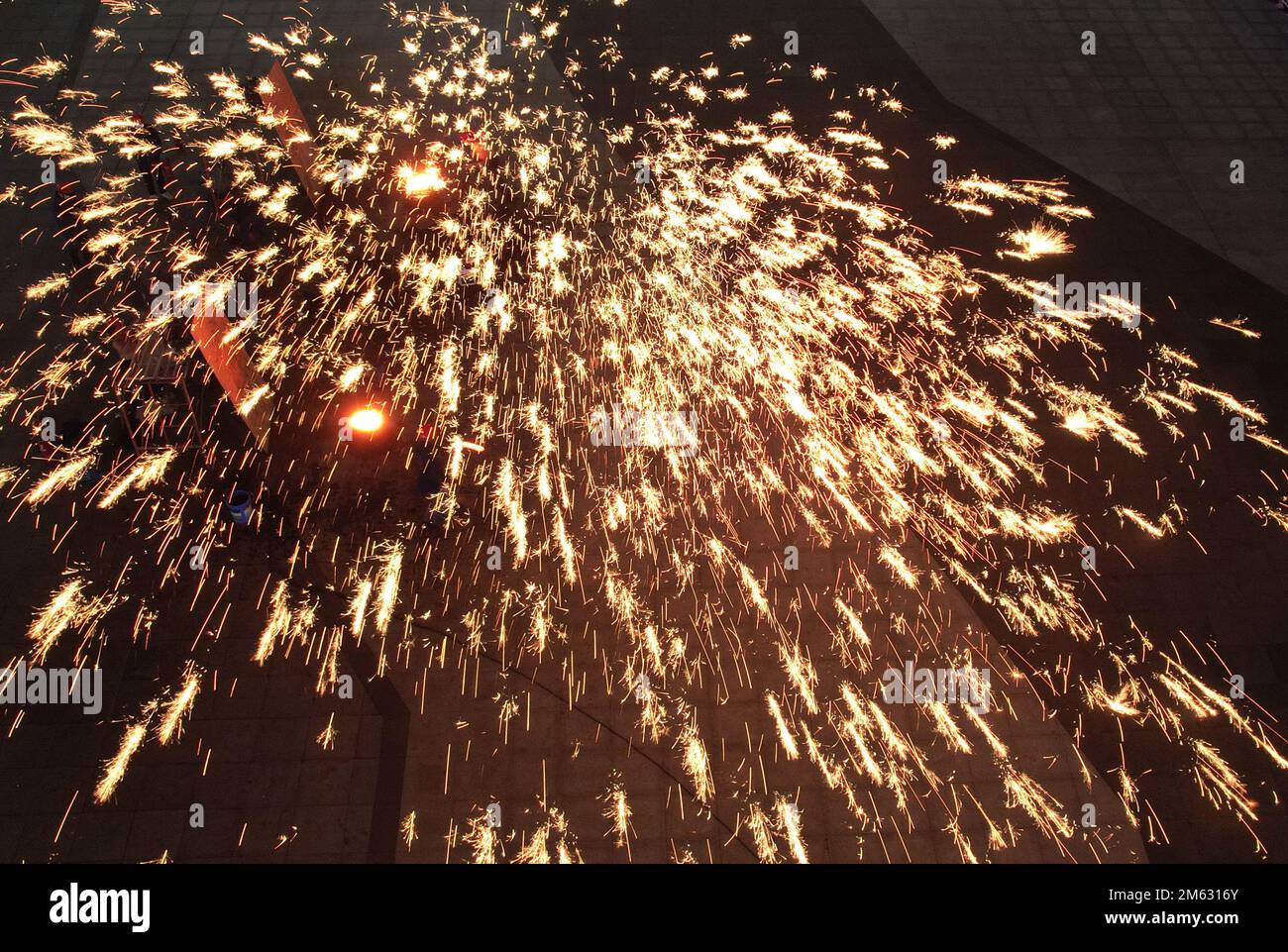 Aerial photo shows people watching the "Iron Flower" performance of an ...
