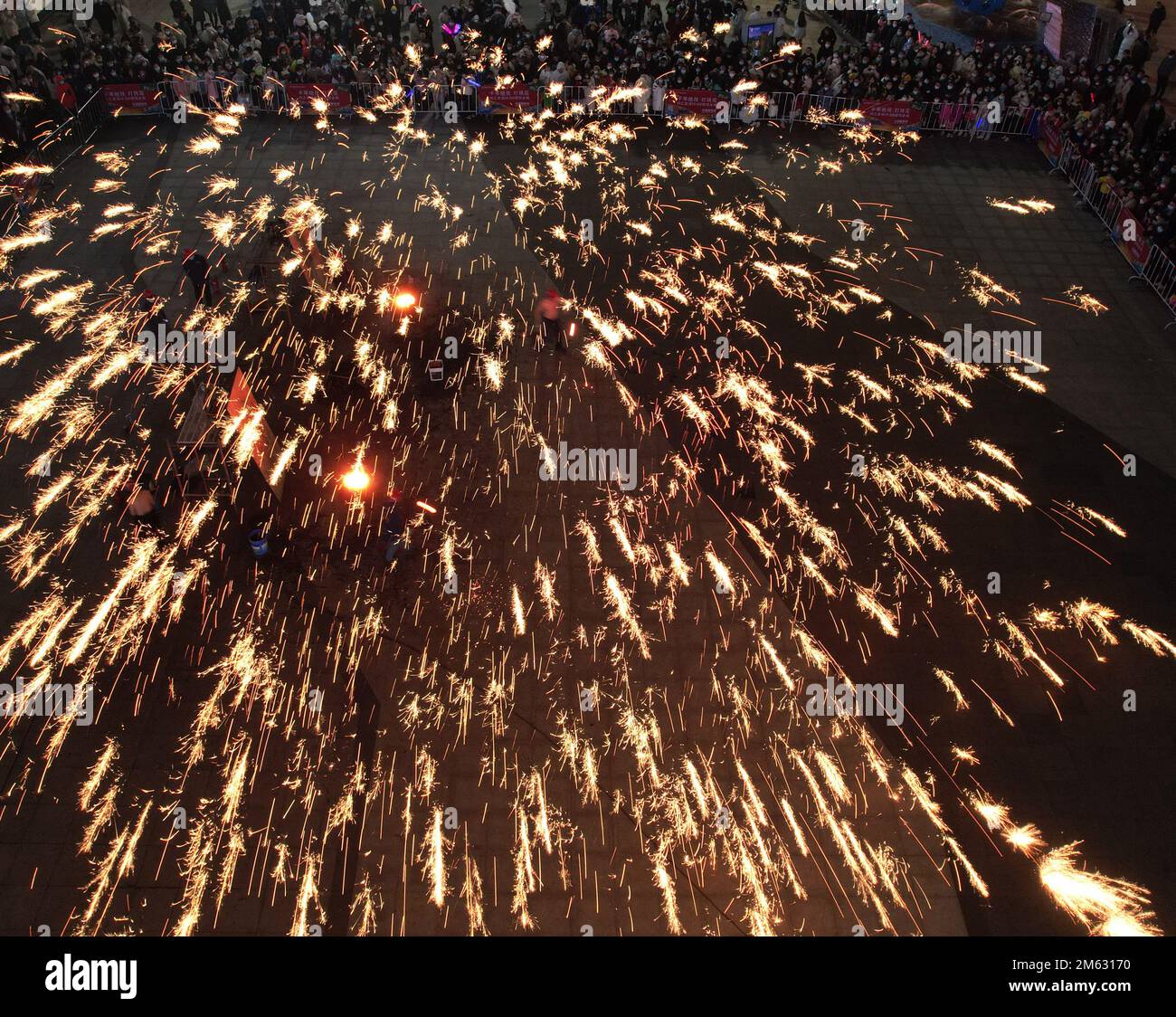 Aerial photo shows people watching the "Iron Flower" performance of an ...