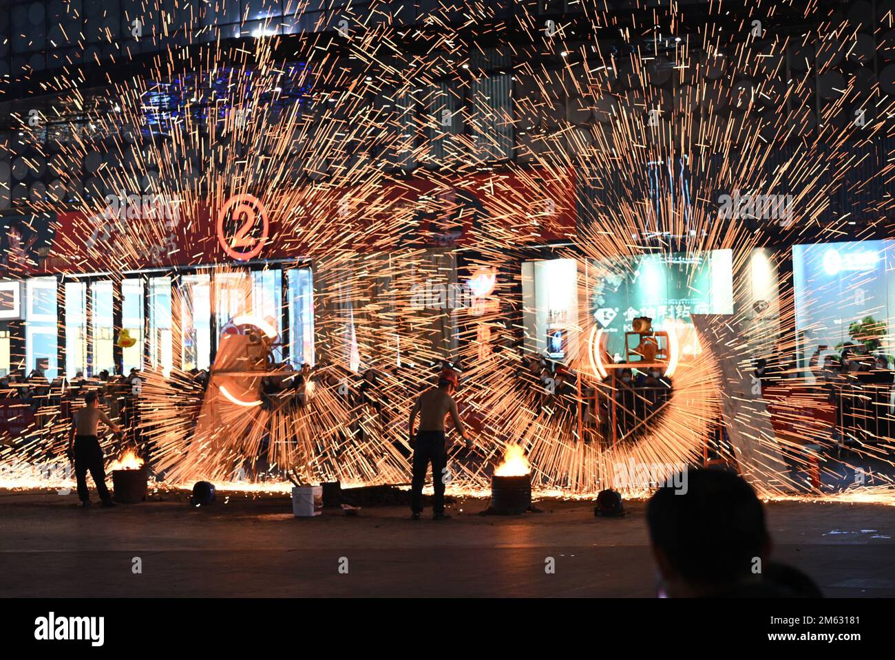 Aerial photo shows people watching the "Iron Flower" performance of an ...