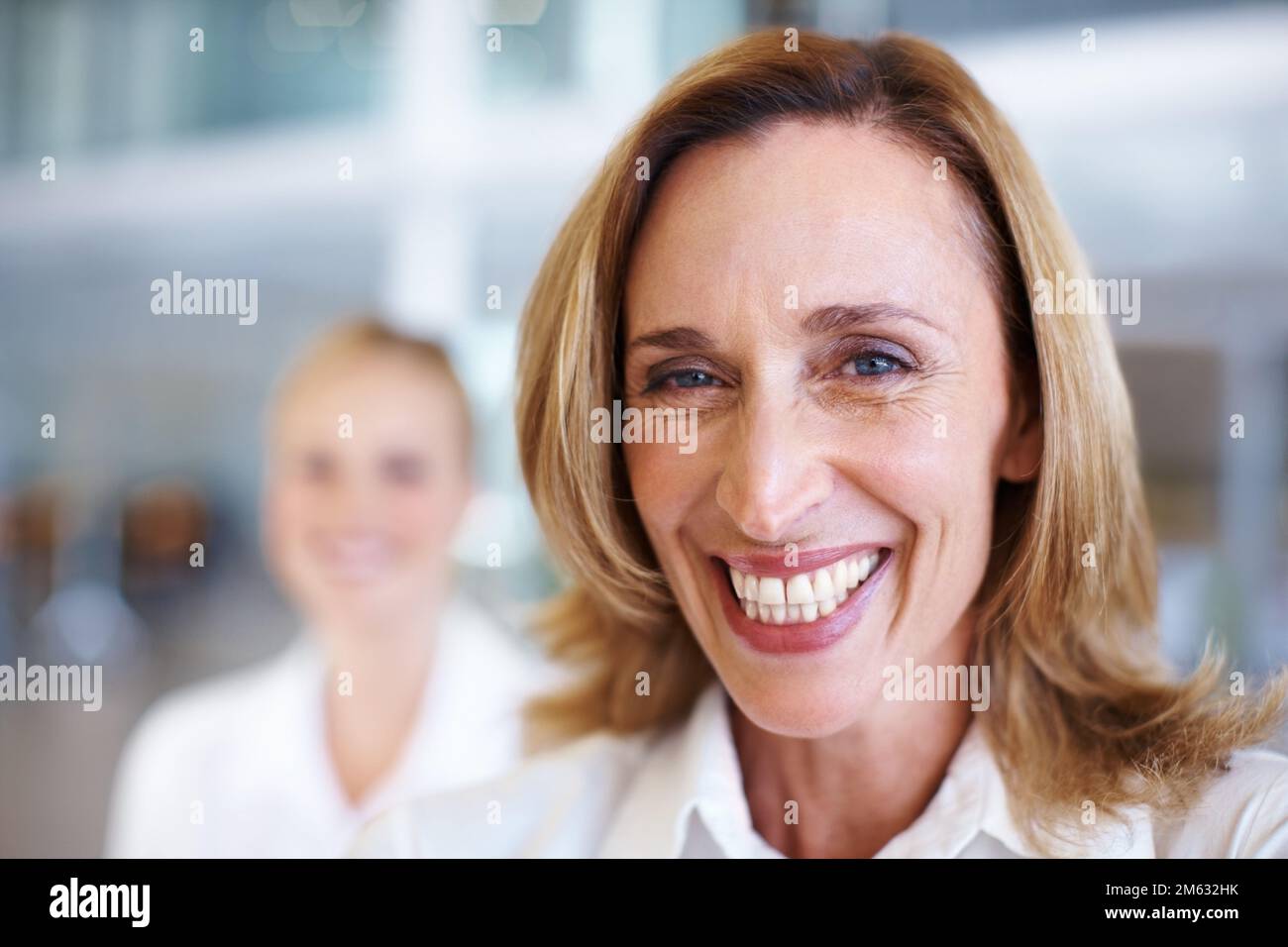 Mature executive with business woman. Closeup of elegant mature female ...