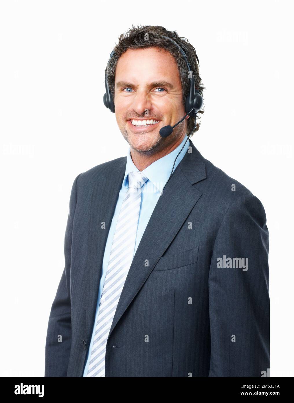 Handsome operator smiling. Portrait of smart operator talking on headset against white ...