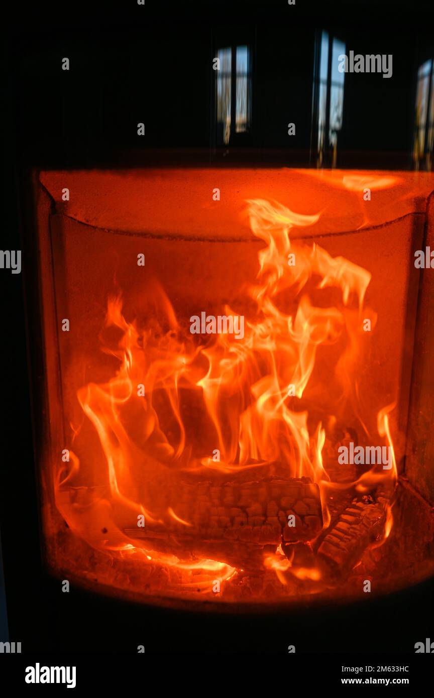 Wood burning in fireplace reflection hi-res stock photography and ...