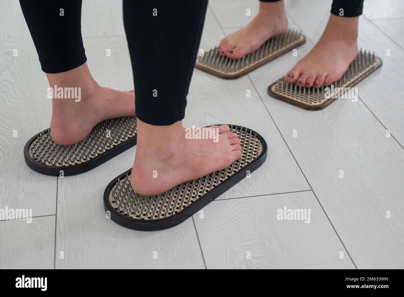 Caucasian and Asian women stand up sadhu boards together Stock Photo ...