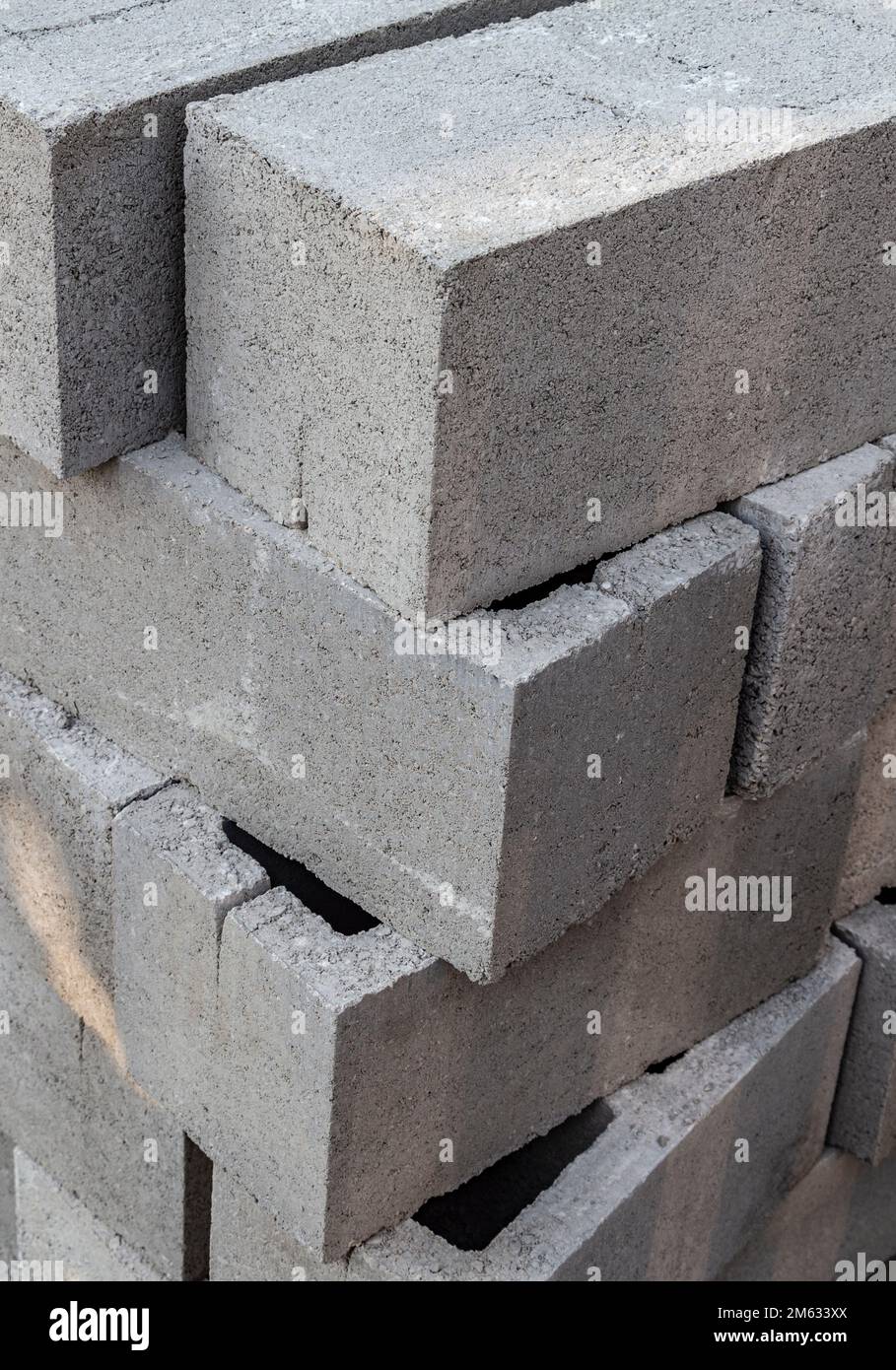 Large stack of gray concrete building blocks Stock Photo - Alamy