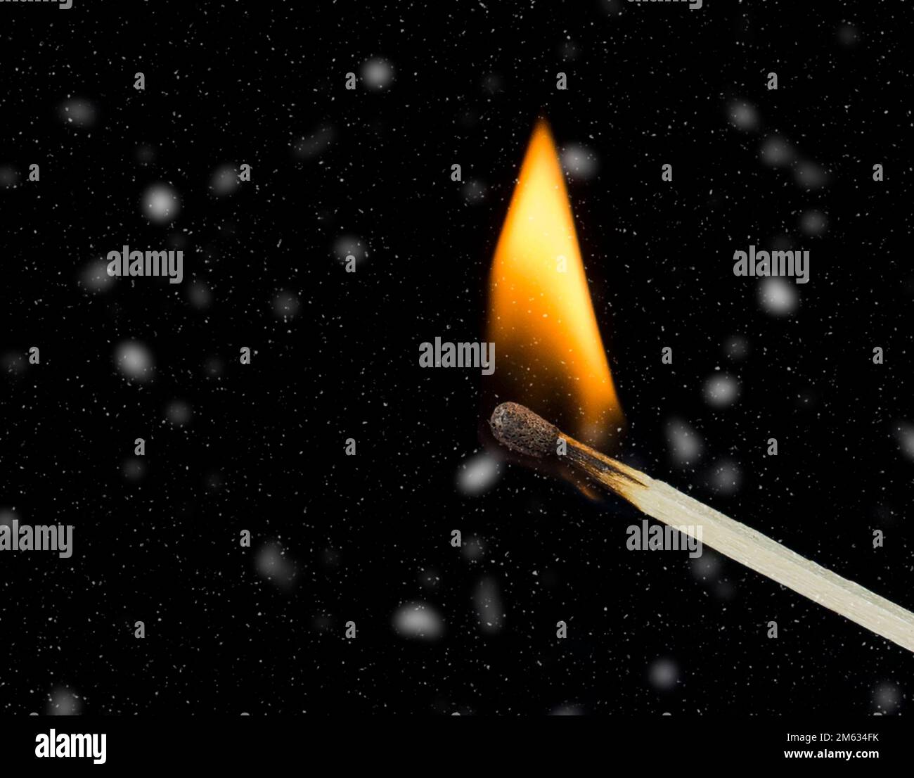 flame match snow snowfall in the cold winter night background like ...