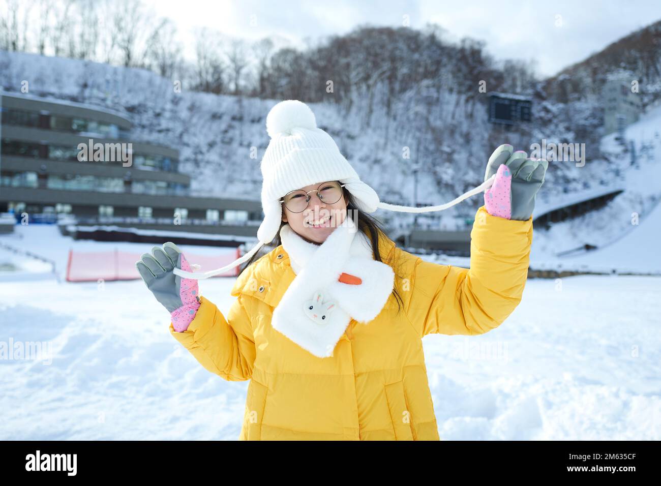 Beautiful asian little girl smiling happy with travel in snow winter ...