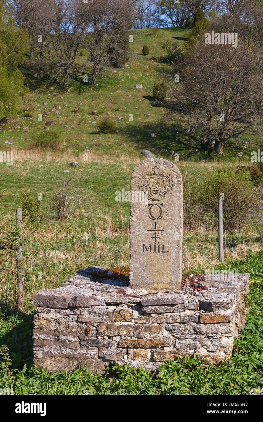 Old milestone at the roadside Stock Photo - Alamy