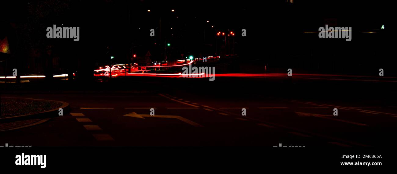 Lights of cars at night. Street line lights. Night highway city. Long ...