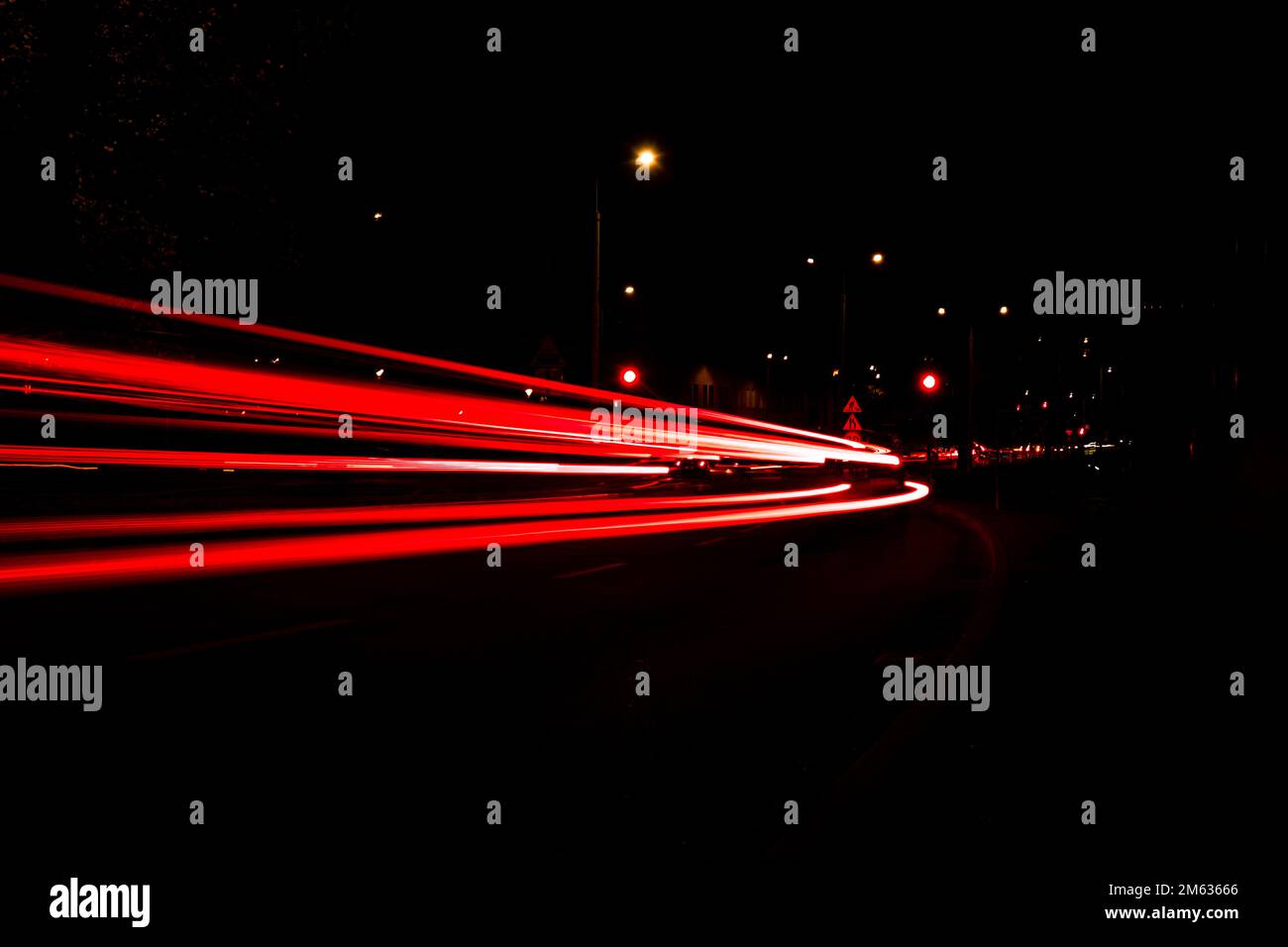 Lights of cars at night. Street line lights. Night highway city. Long ...