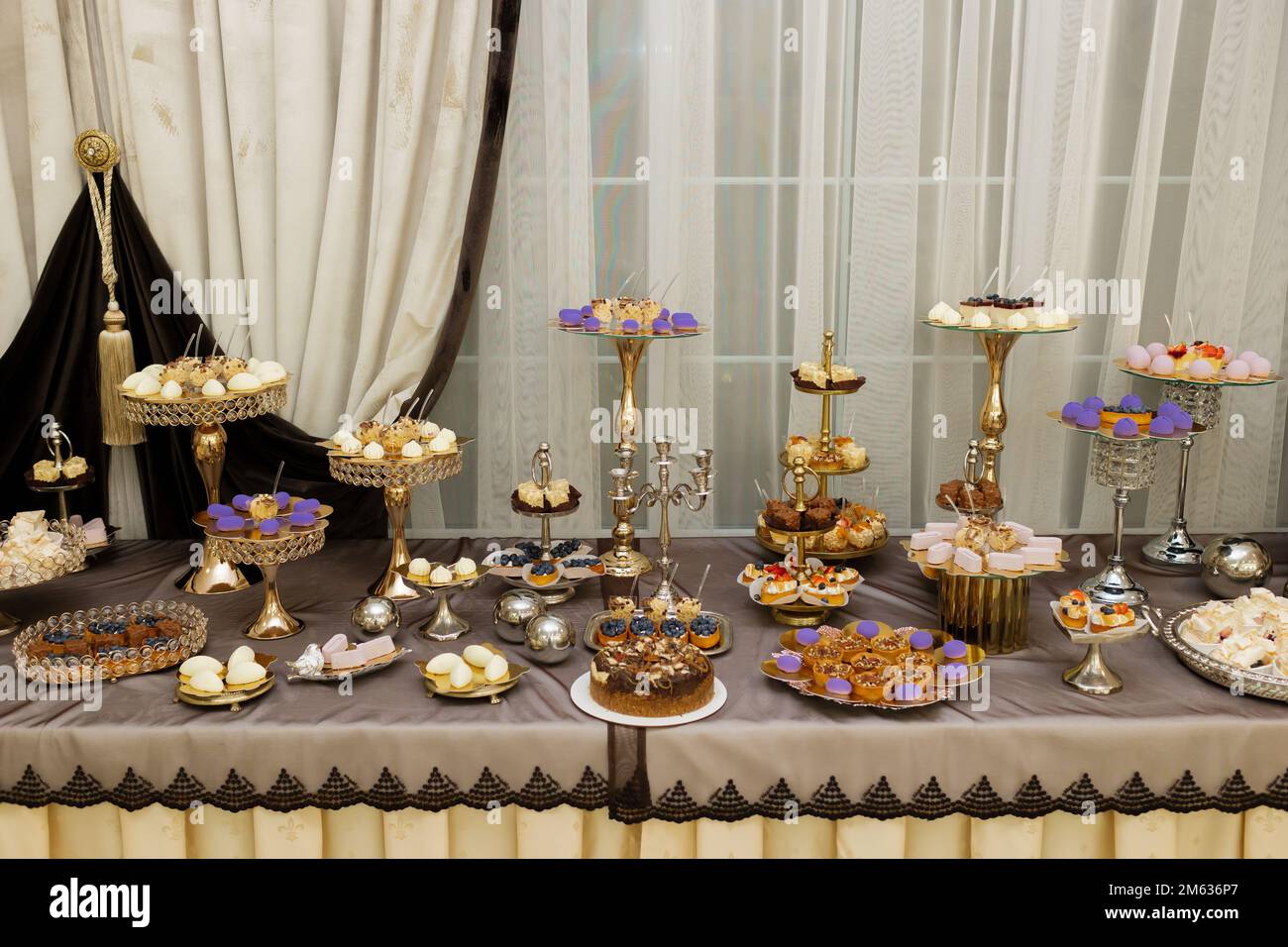 Table with cakes, sweets, candy, buffet. Dessert table for a party ...