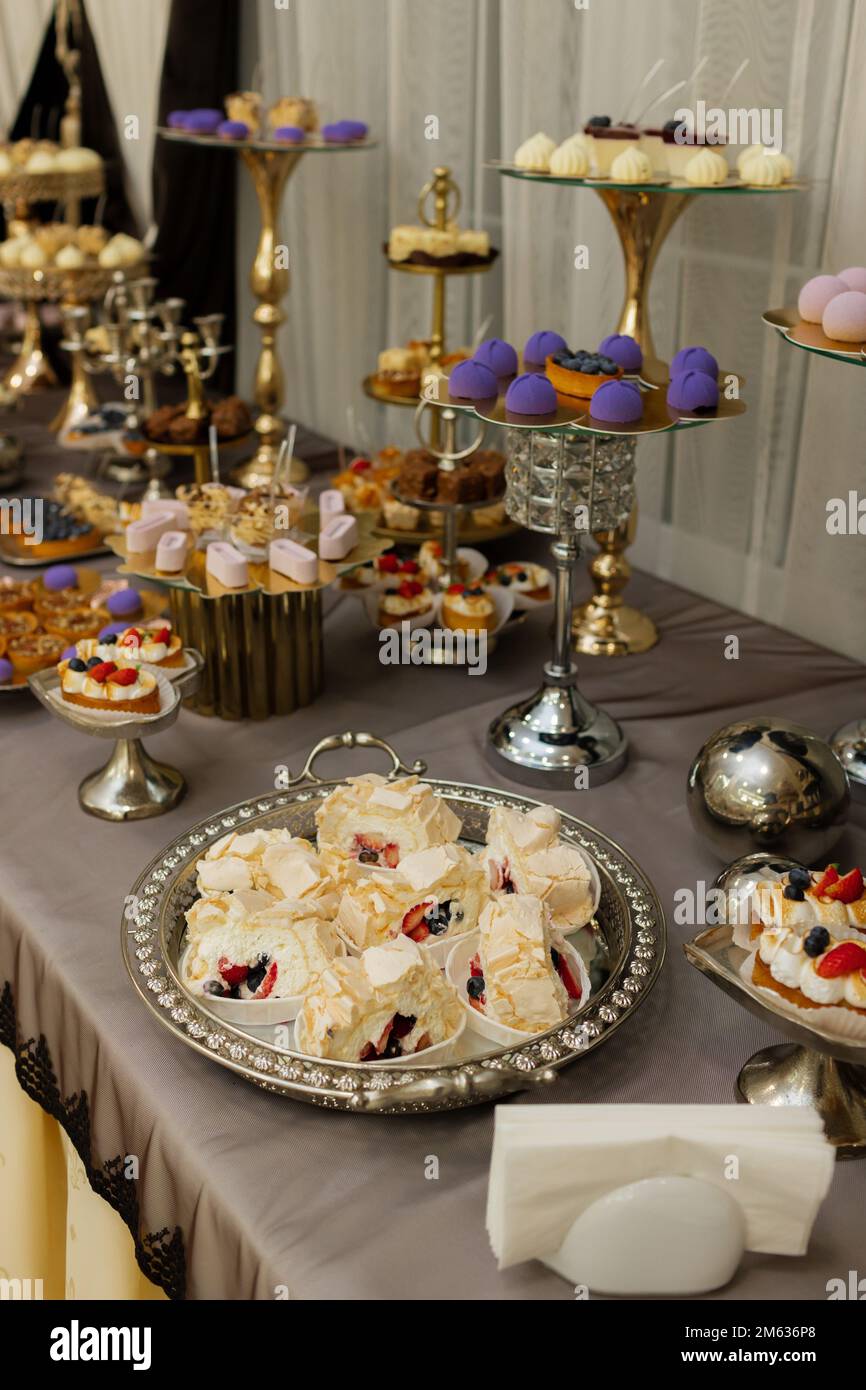 Table with cakes, sweets, candy, buffet. Dessert table for a party ...