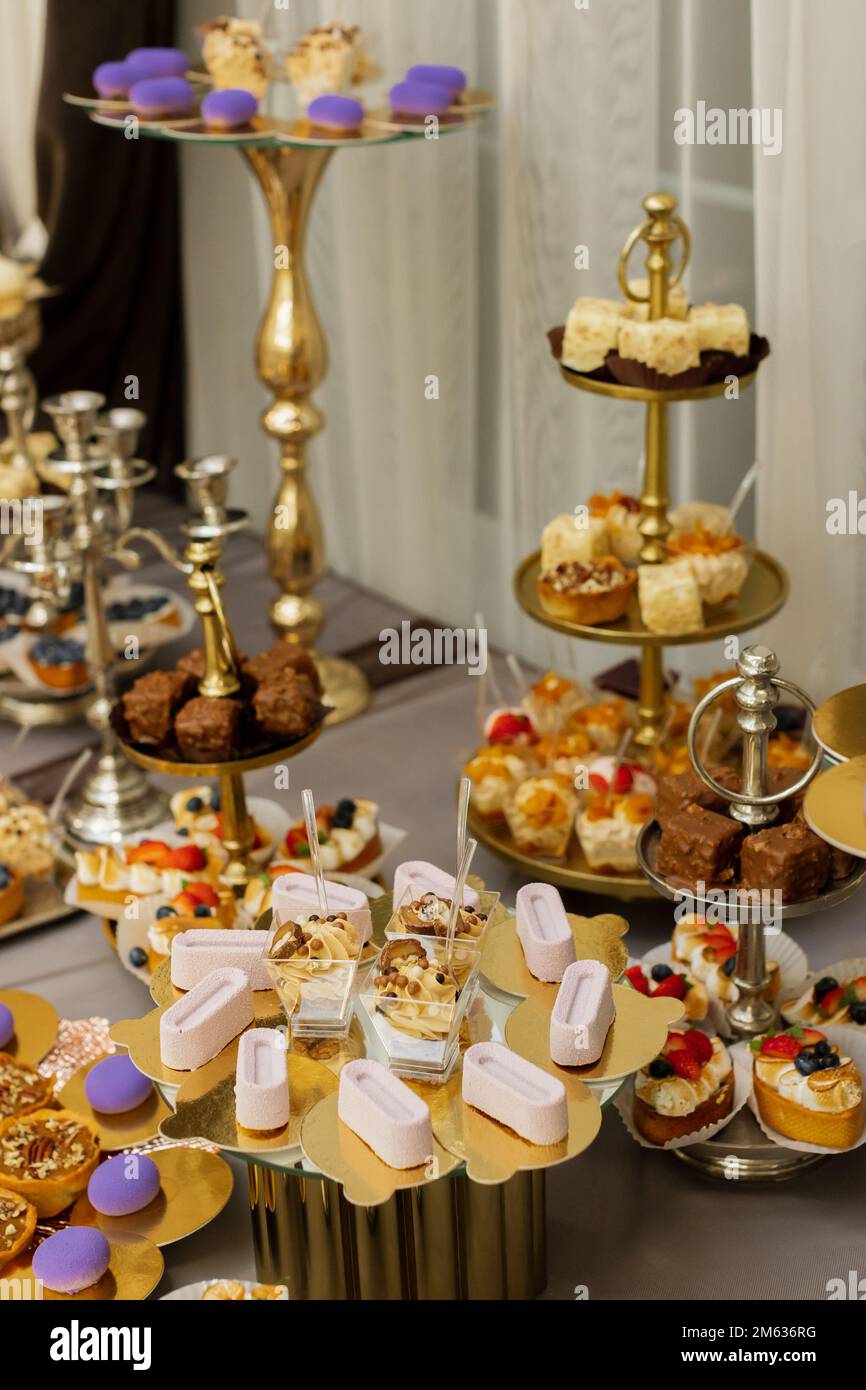 Table with cakes, sweets, candy, buffet. Dessert table for a party ...