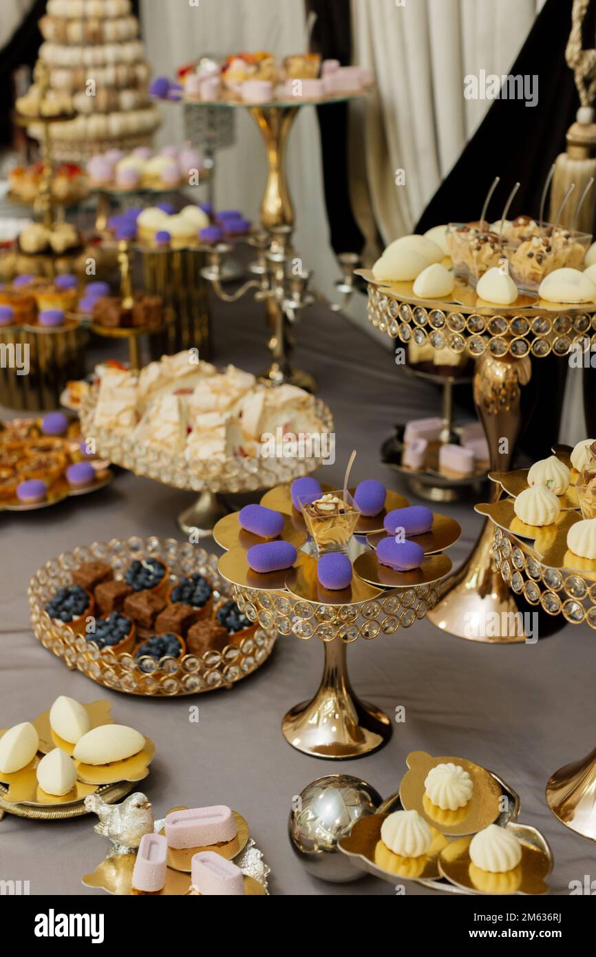 Table with cakes, sweets, candy, buffet. Dessert table for a party ...