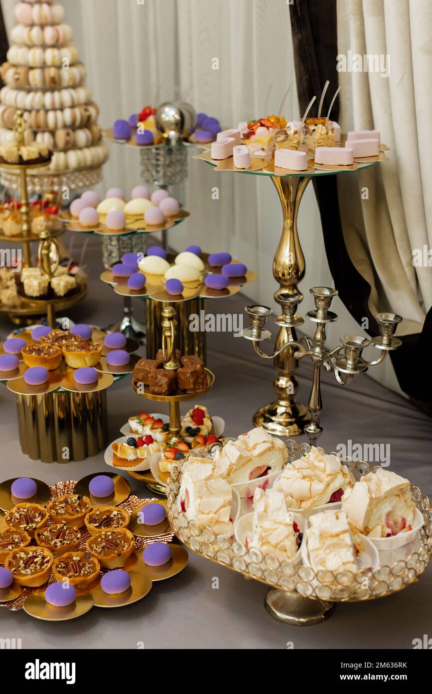Table with cakes, sweets, candy, buffet. Dessert table for a party ...