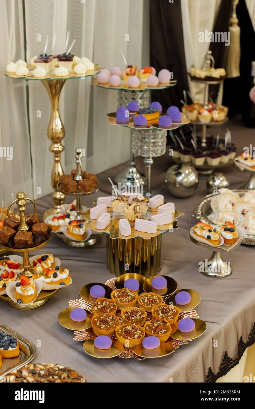 Table with cakes, sweets, candy, buffet. Dessert table for a party ...