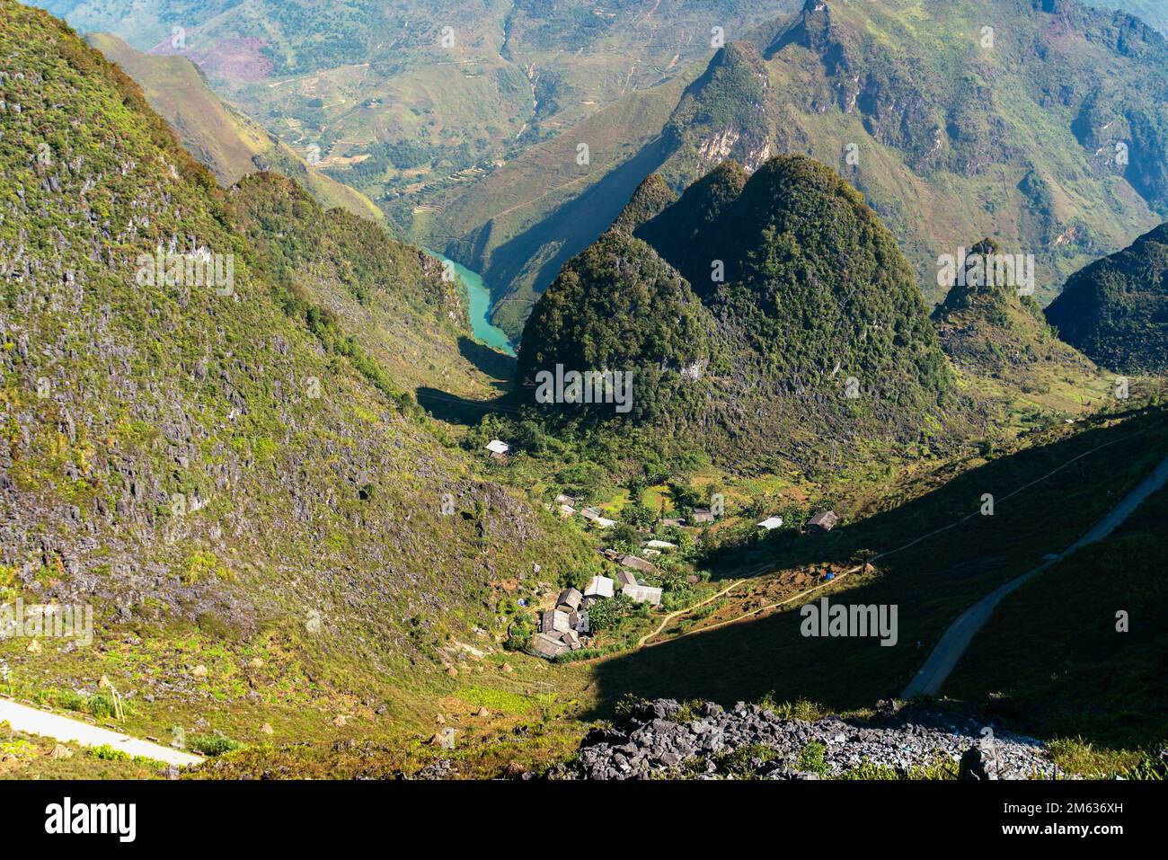 From above spectacular scenery of small settlement located among green ...
