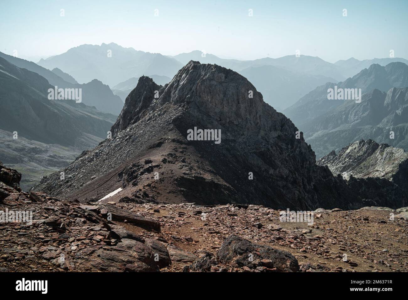 Breathtaking scenery of missive mountain range with sharp peaks covered ...