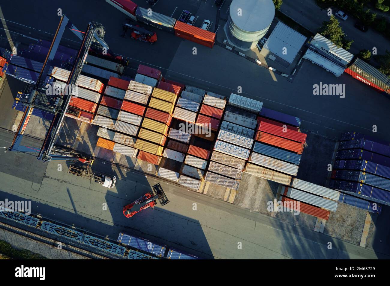MAERSK containers in terminal, Unloading containers in warehouse on ...