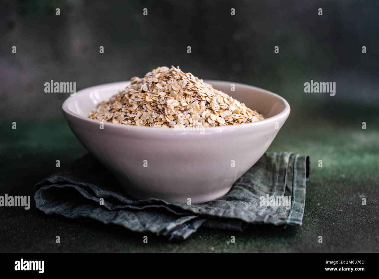Healthy raw oatmeal in the bowl as a porridge cooking concept Stock ...