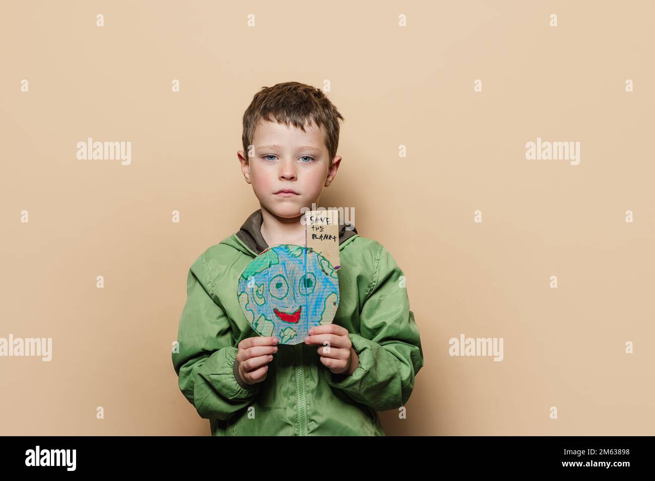 Boy in green coat hi-res stock photography and images - Alamy