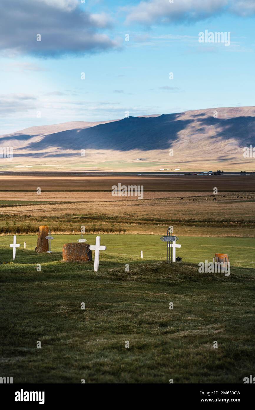 Picturesque landscape of catholic cemetery with white tombstones placed ...