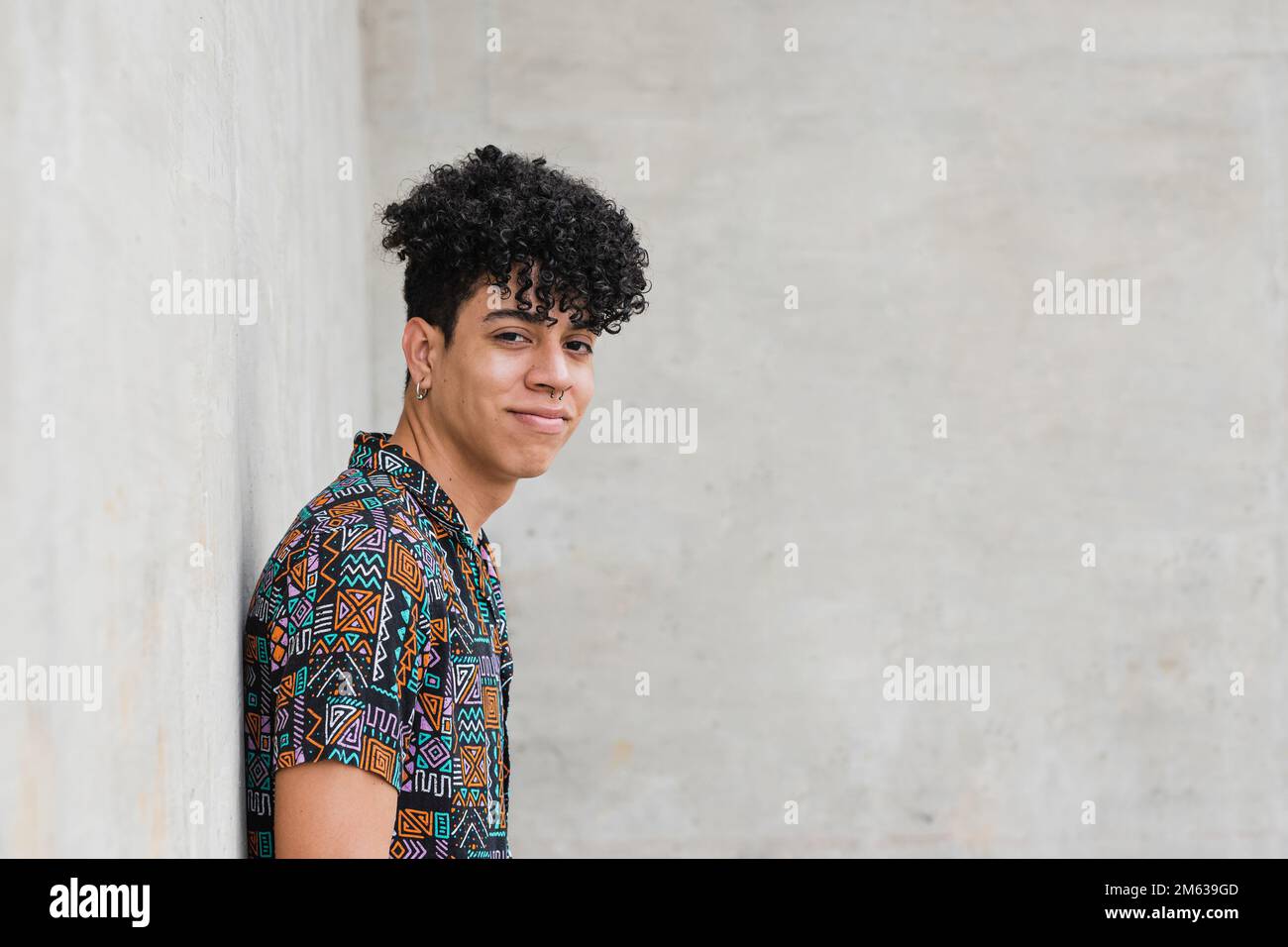 Side view of ethnic man in shirt and trousers with Afro hairstyle ...