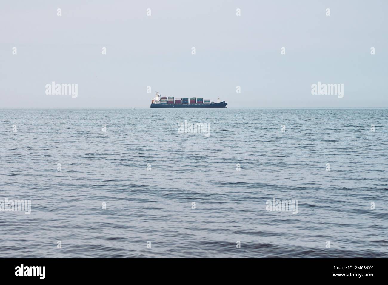 Picturesque scenery of large cargo vessel with containers floating on ...