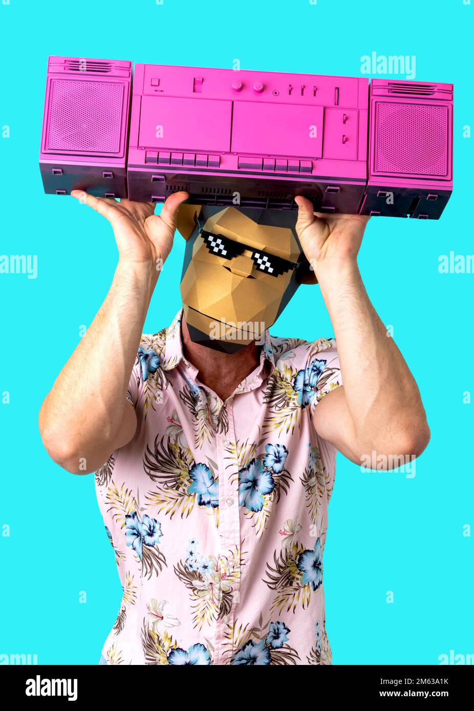 Unrecognizable male model in pixel monkey mask and summer shirt holding ...