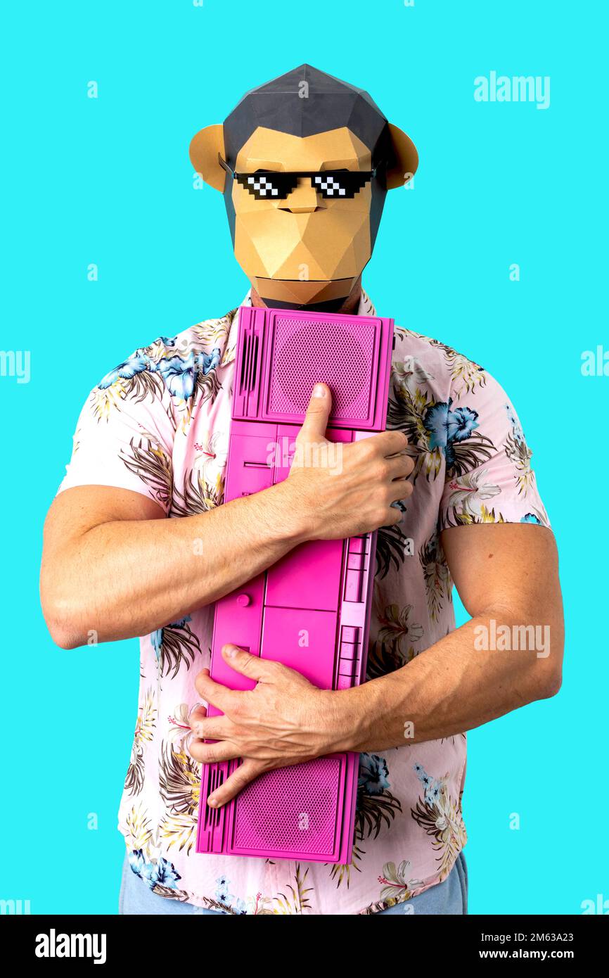 Anonymous young guy in floral shirt and creative pixel monkey mask with ...