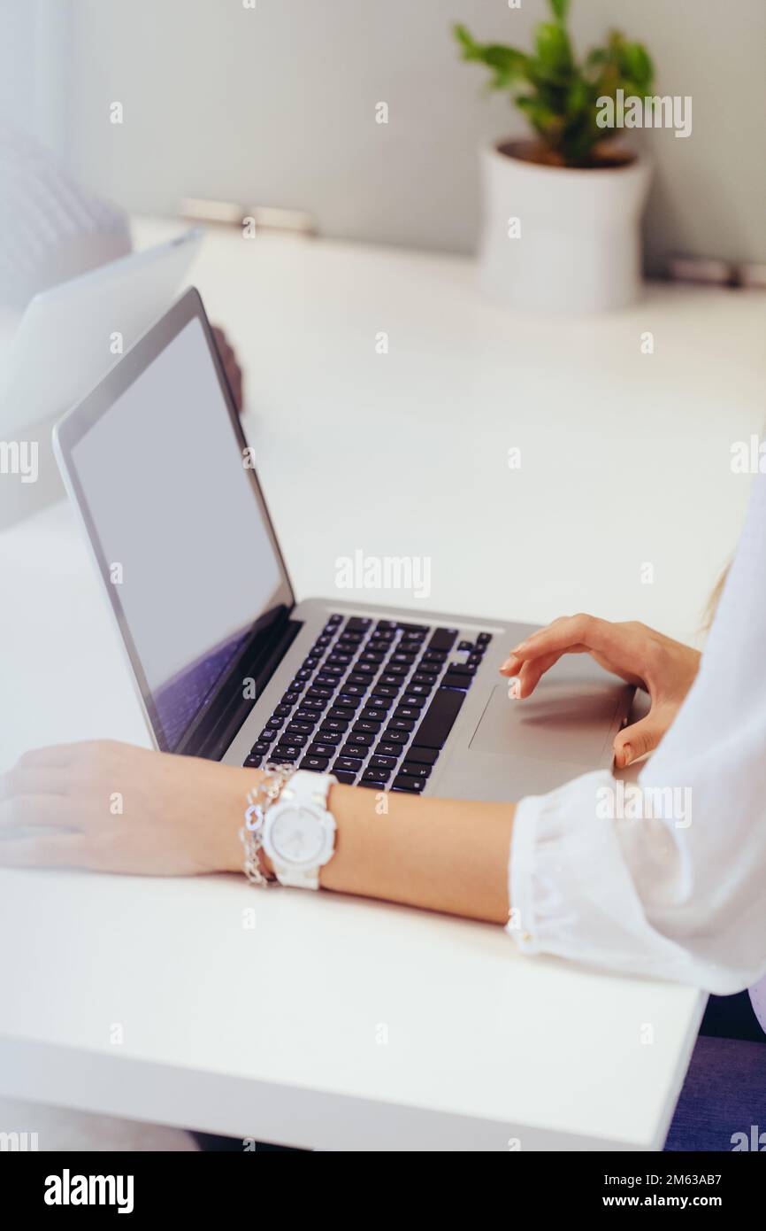 Anonymous woman typing on Her Laptop Stock Photo - Alamy
