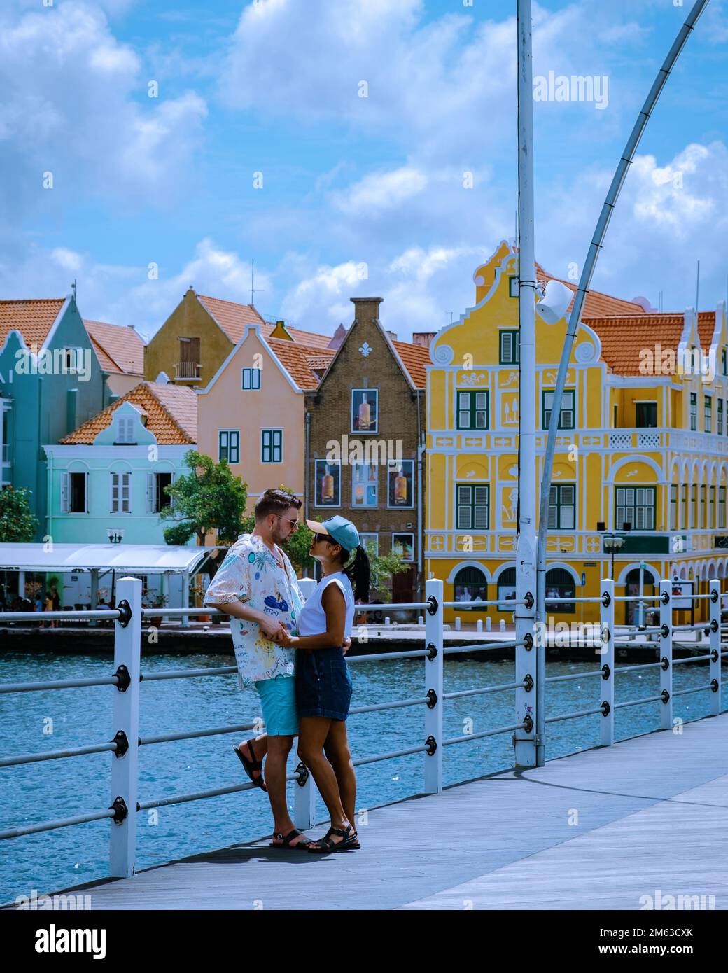 Curacao, Netherlands Antilles happy couple of Asian women and Caucasian ...