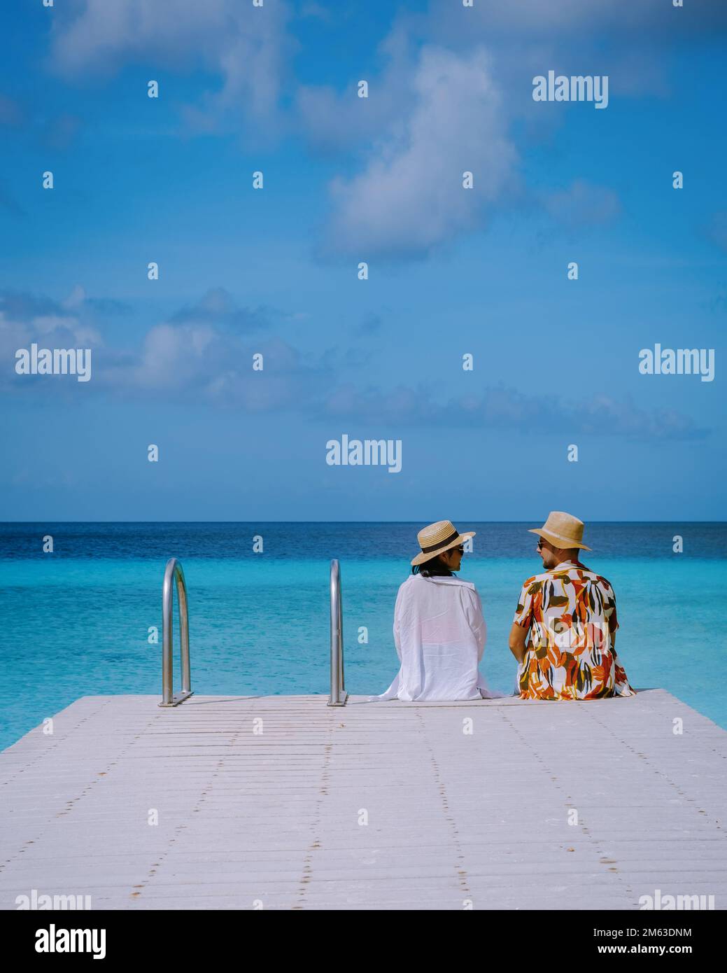 a couple visit Playa Porto Marie beach Curacao, white tropical beach ...