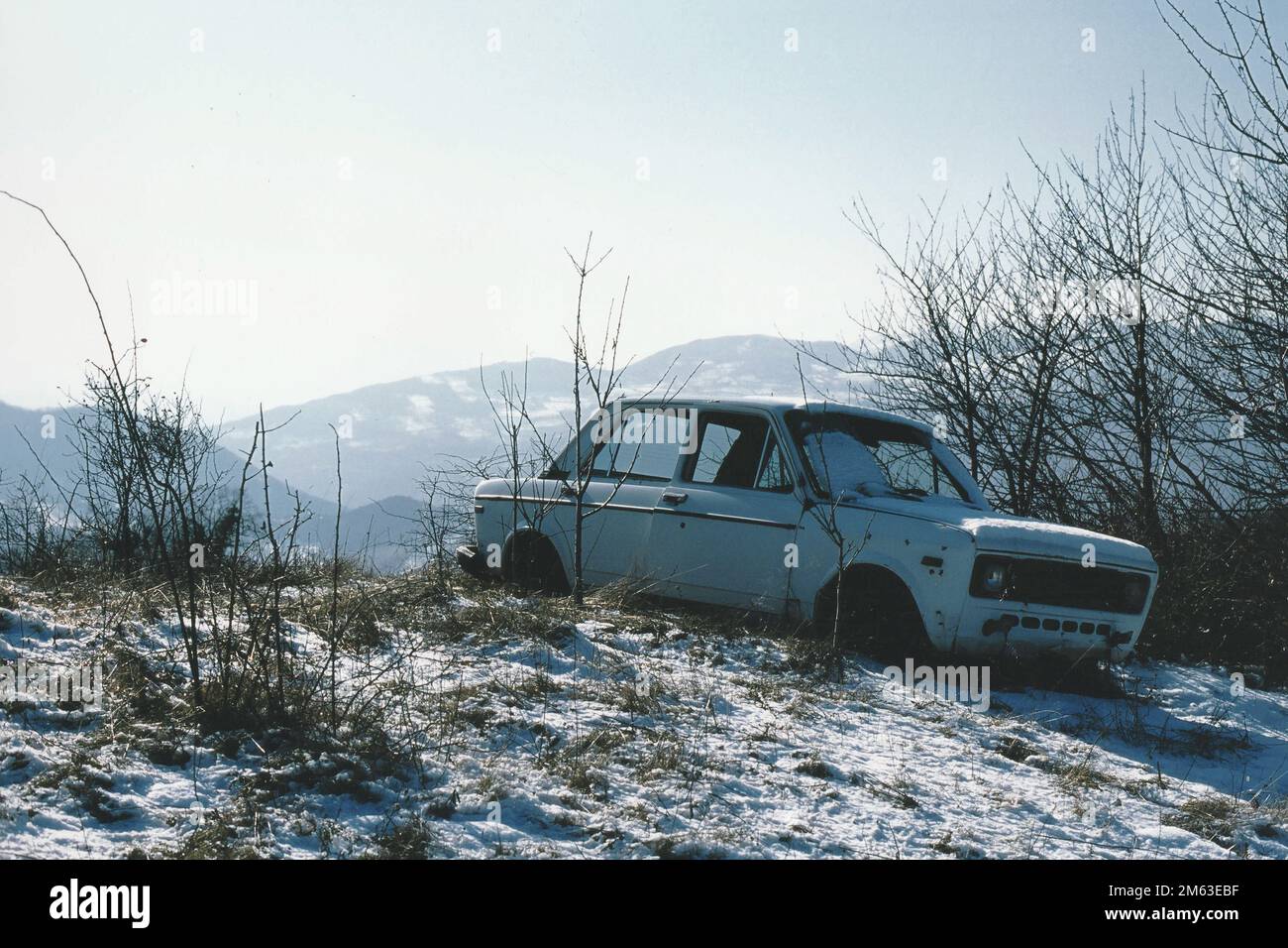Old car abandoned in a field Stock Photo - Alamy