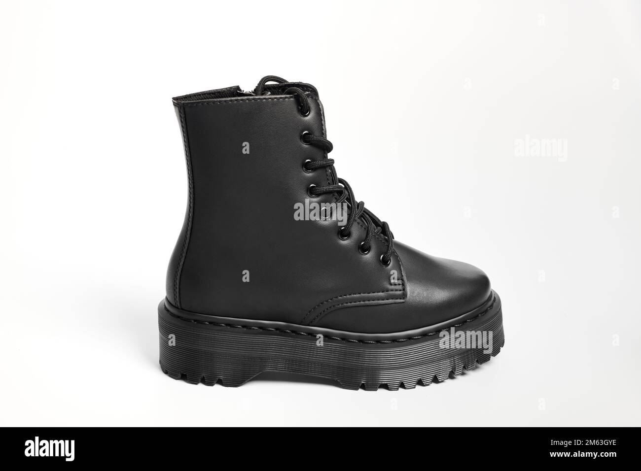 One black women combat boot on high heel platform with lug sole on ...