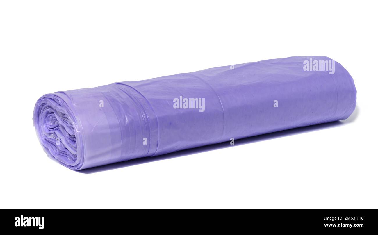 Purple plastic trash bags with strings on white background, close up ...