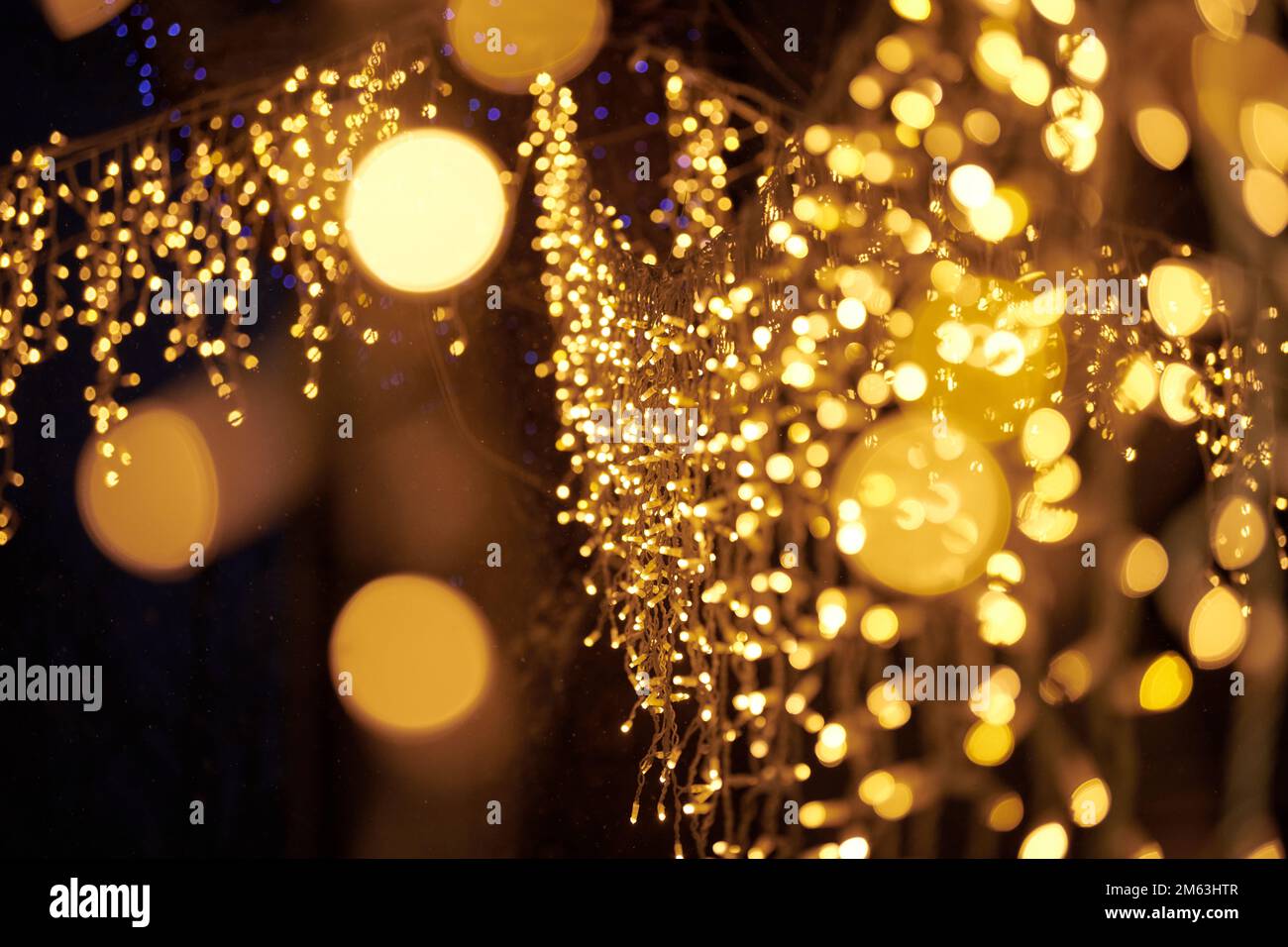 Yellow lights bokeh from christmas holiday garlands, blurred festive ...